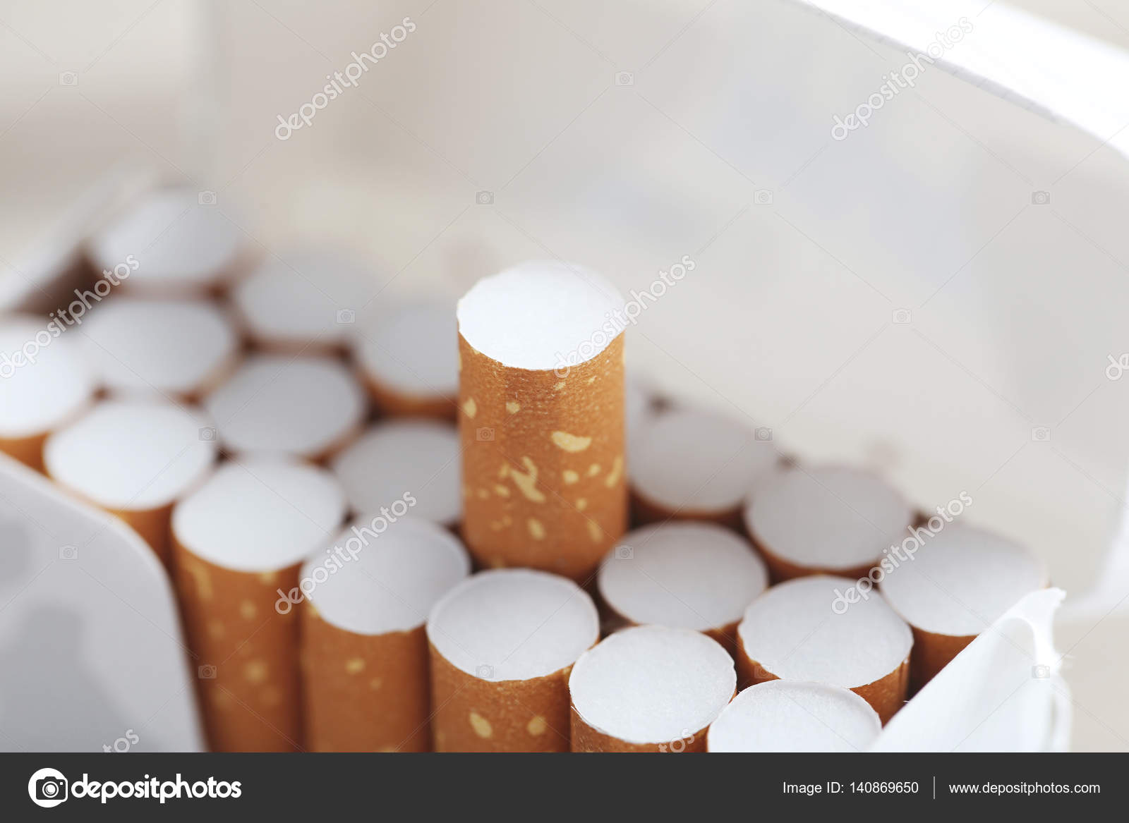 Open pack of cigarettes Stock Photo by ©5seconds 140869650
