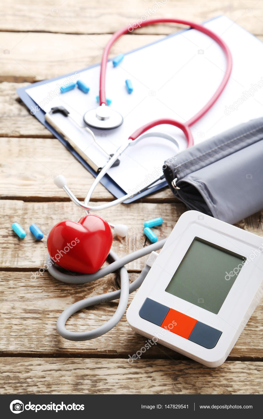 Electric tonometer with stethoscope and red heart Stock Photo by ...