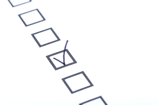 Check boxes on white paper — Stock Photo © 5seconds #134286362