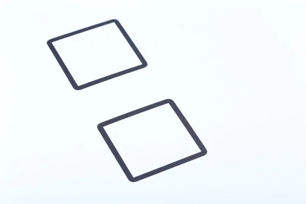 Check boxes on white paper — Stock Photo © 5seconds #134286362