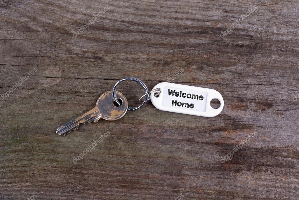 Old key With Welcome Home Text. Wooden texture background — Stock Photo ...