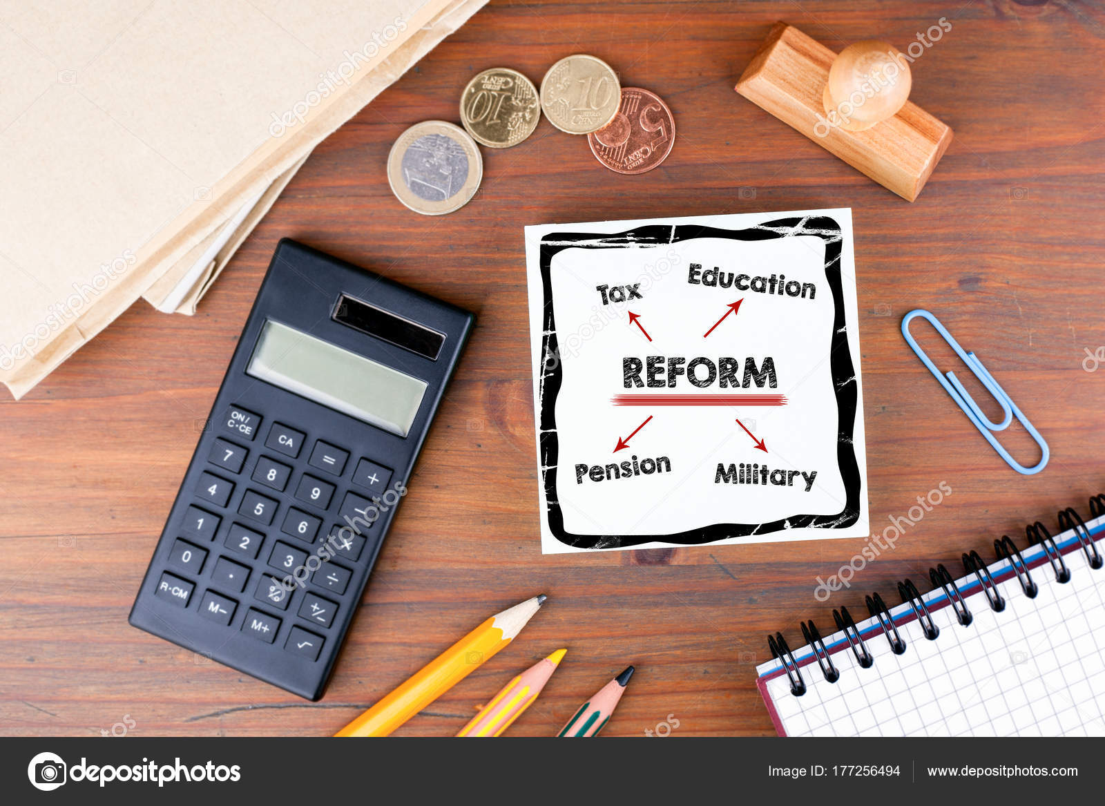 Reform concept. Office desk with stationery, chart and communication ...