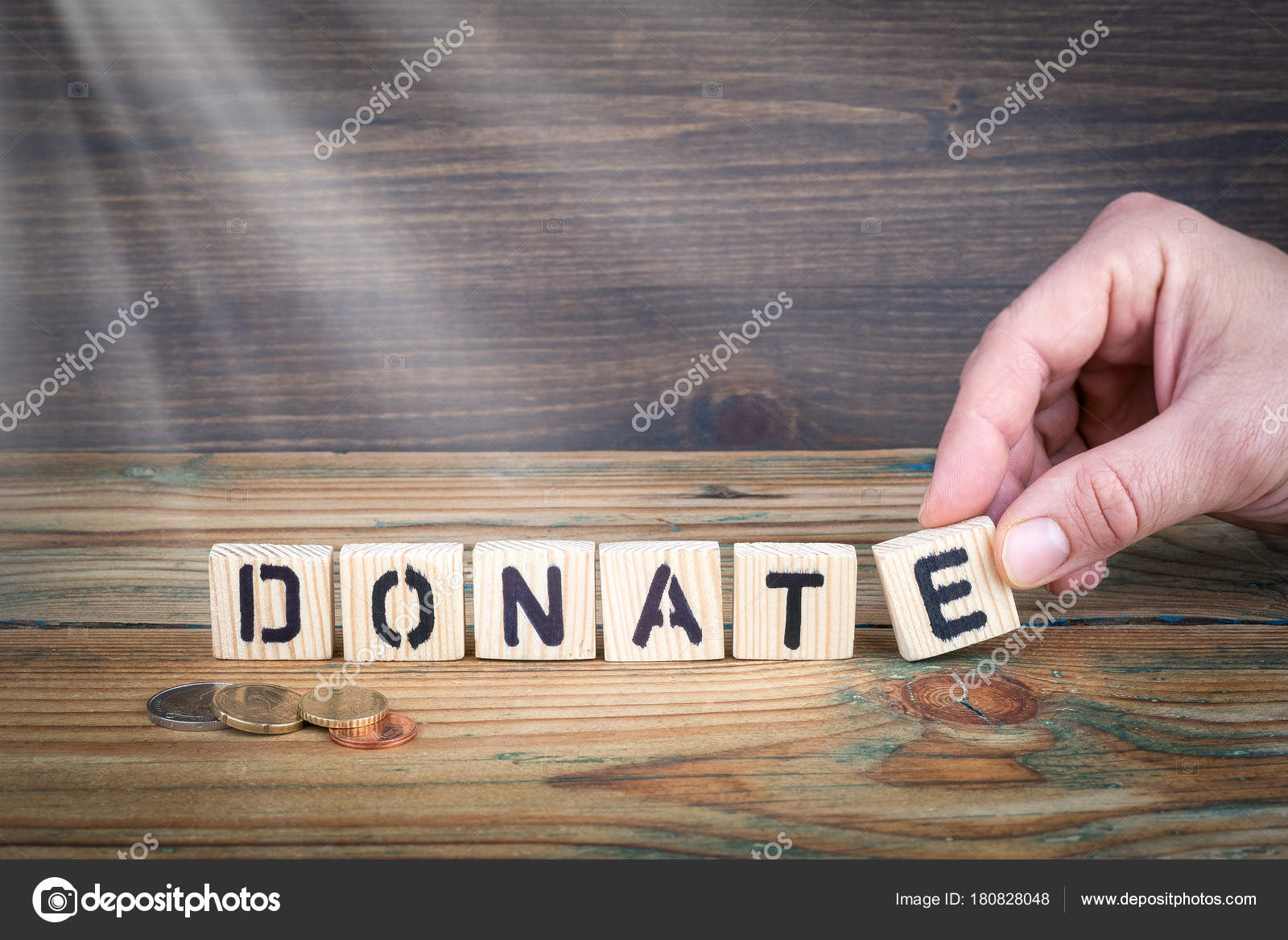 Donate. Wooden letters on the office desk, informative and ...