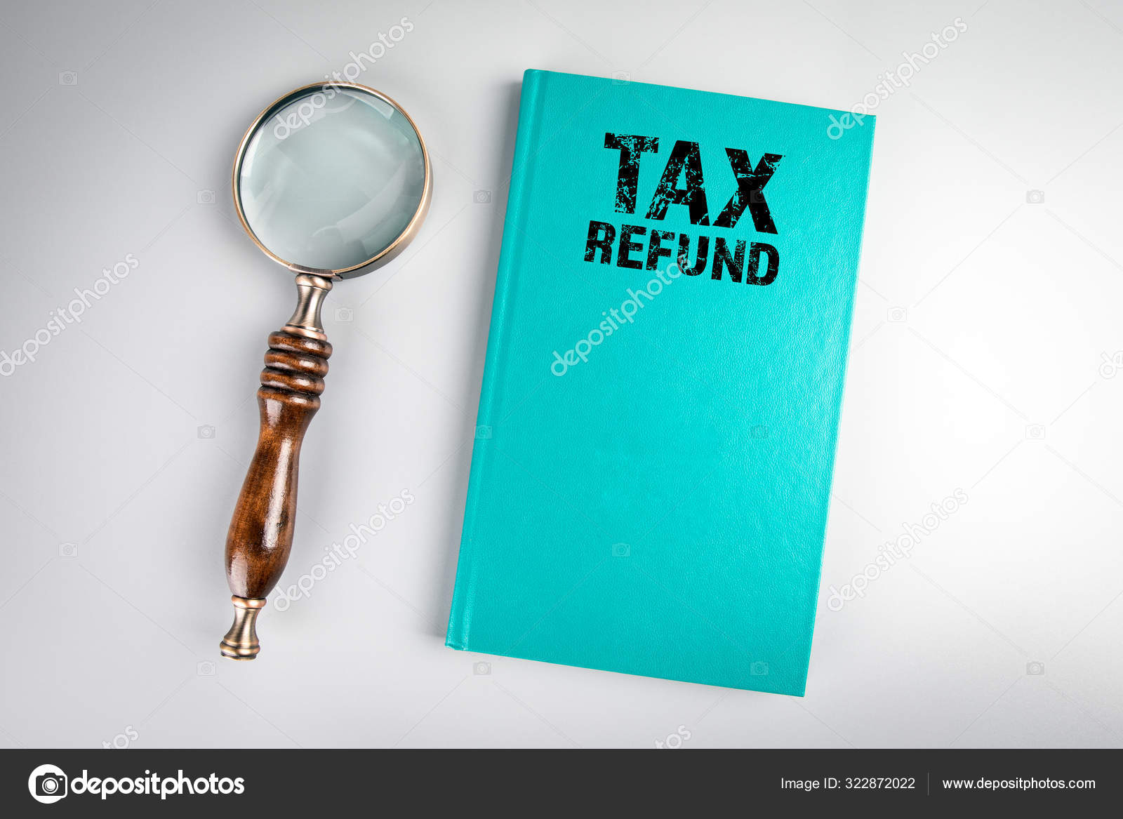 Tax Refund. Green book cover and magnifying glass — Stock Photo ...