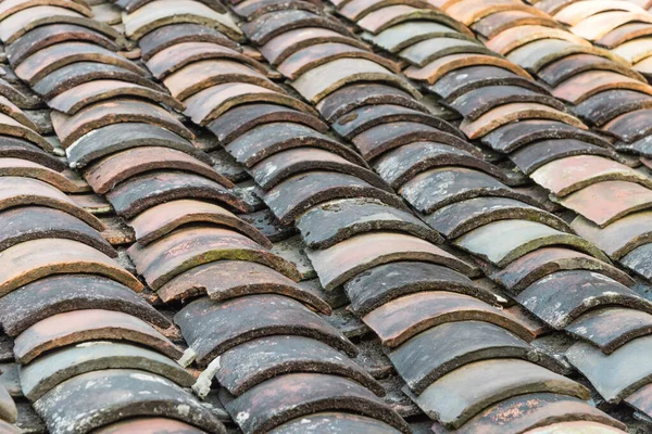 Colorful curved clay tiled roof from ancient house in the North Vietnam ...