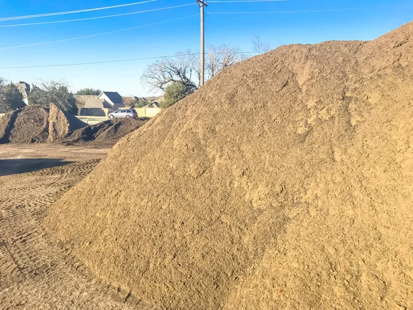 Large heap of organic topsoil pile at wholesale compost plant near ...