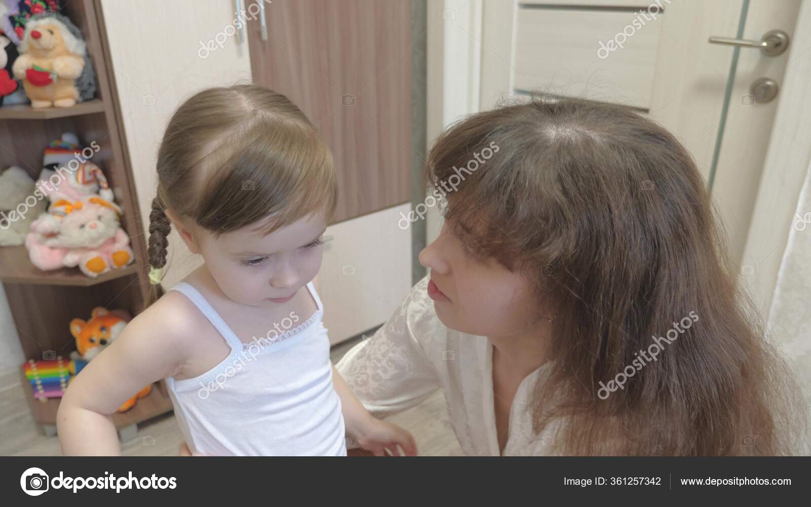 Happy loving daughter hugs a cute mom. little baby hugs mother. happy ...