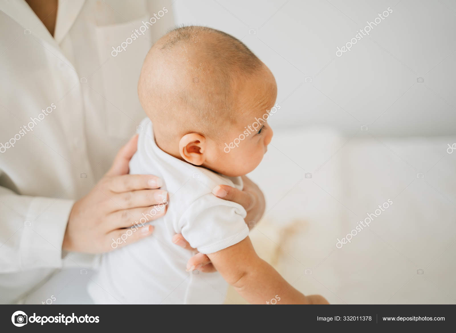 Mother patting on back of Asian baby Stock Photo by ©twinsterphoto ...