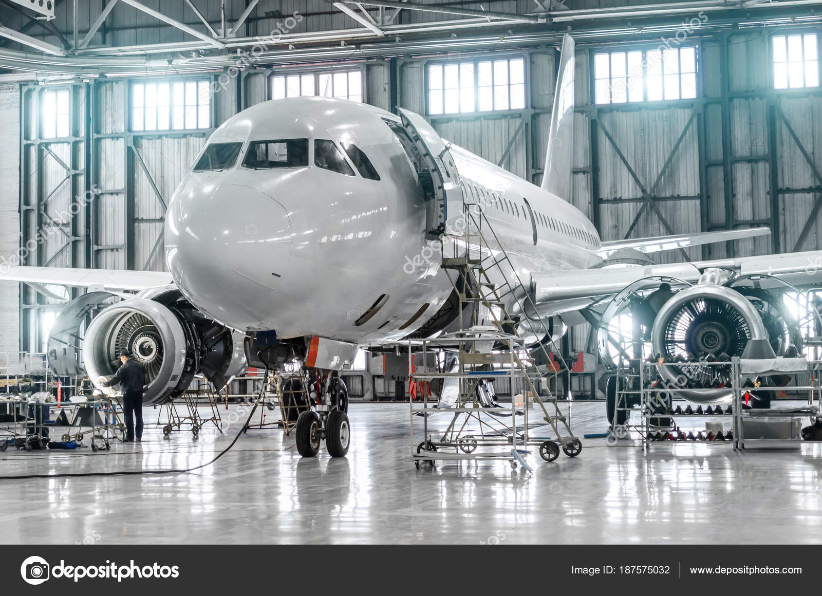 Passenger aircraft on maintenance of engine and fuselage repair in ...