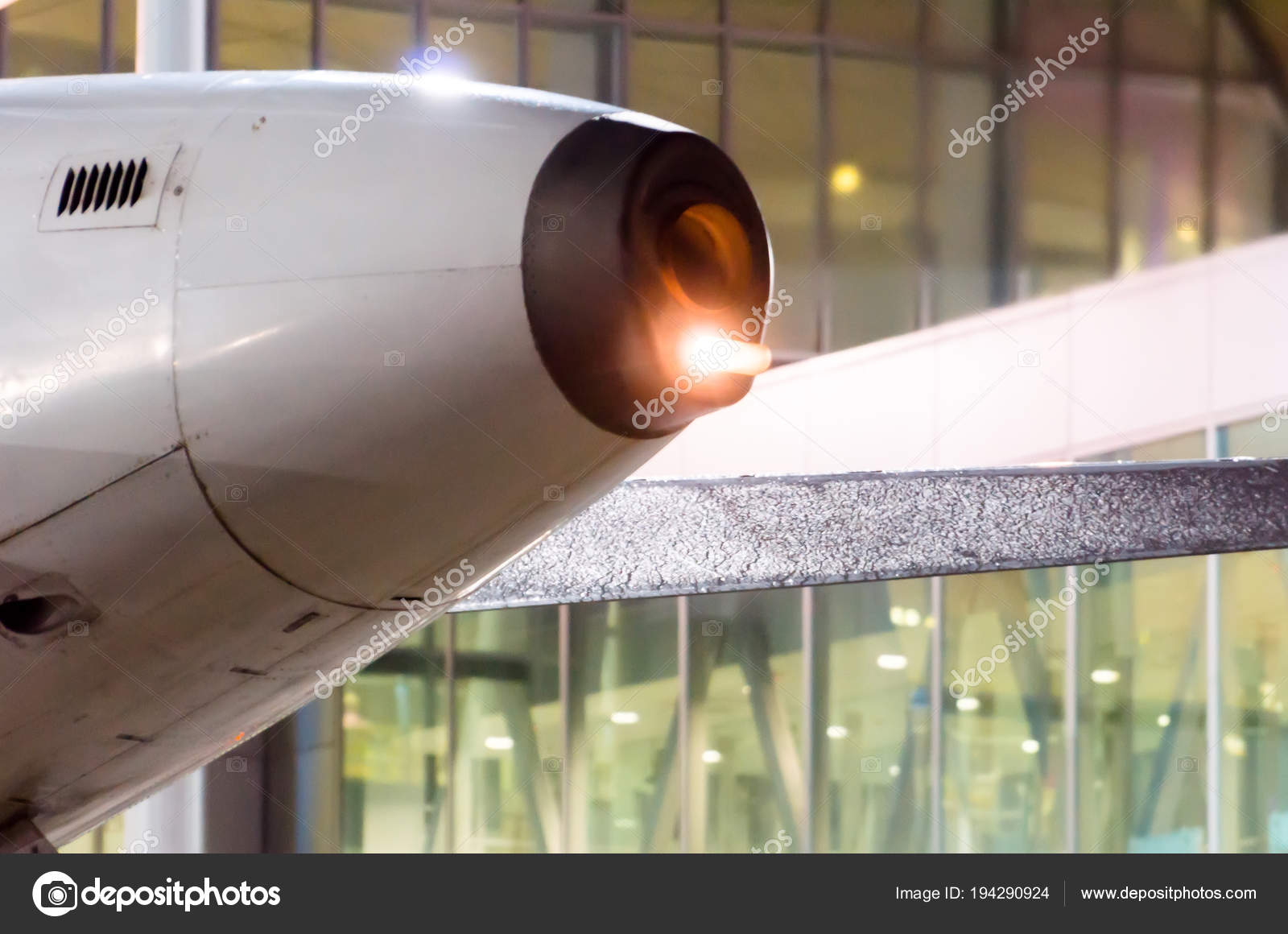 The auxiliary power unit APU of the airplane light on, night. Stock ...