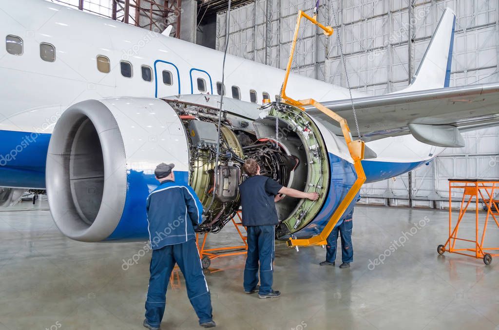 Assembling, replacing engine parts of the plane after repair ...