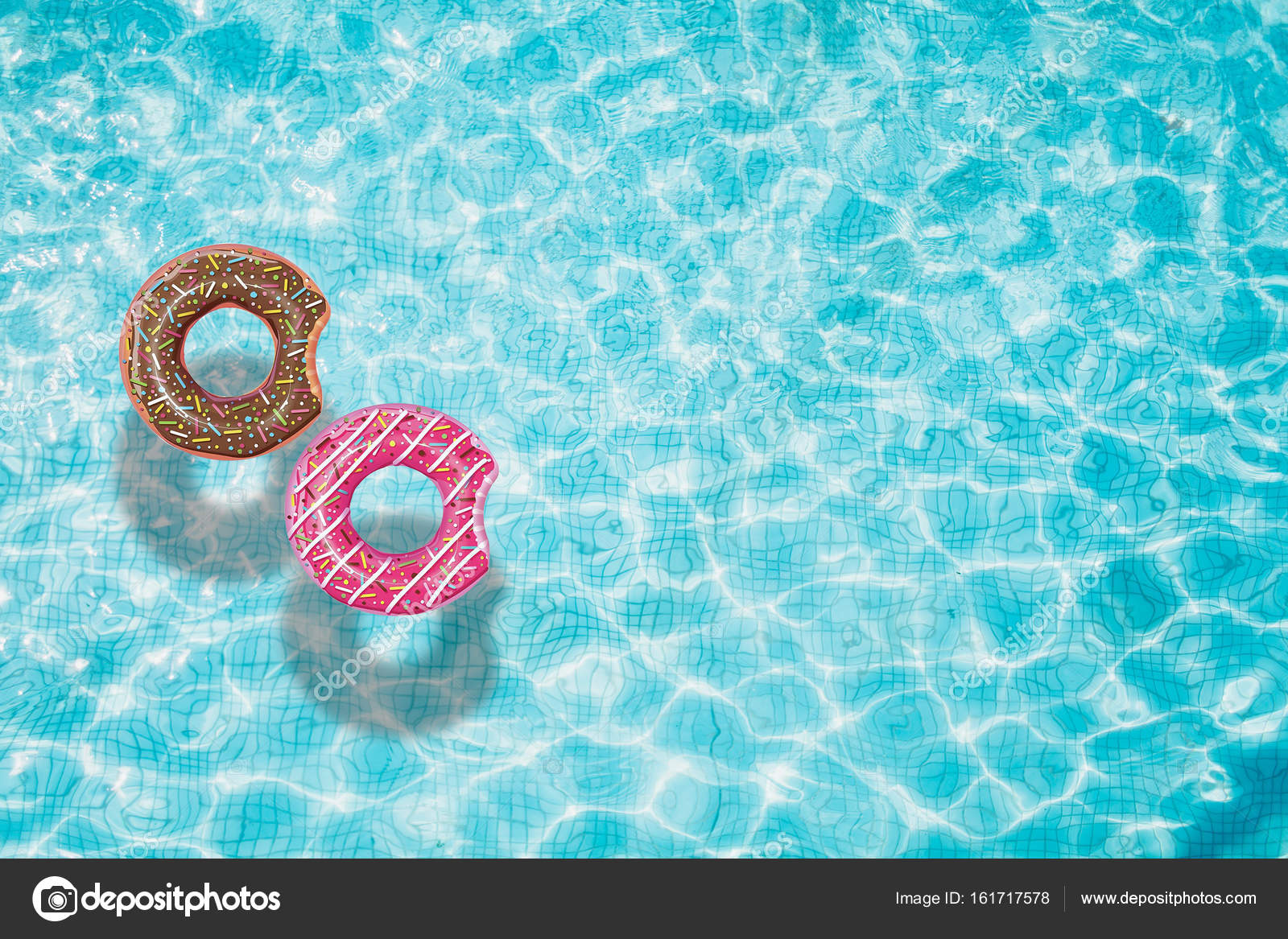 Blue swimming pool with rings floating — Stock Photo © AlexanderMils ...