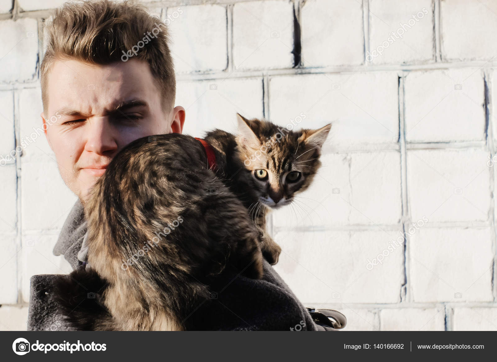 Stylish man with cute kitty Stock Photo by ©Sonyachny 140166692