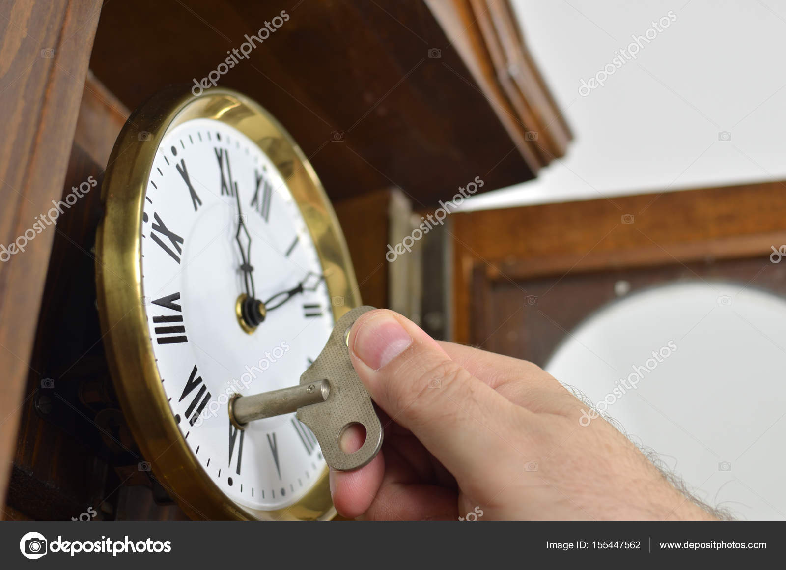 Winding a Wall Clock — Stock Photo © Bane.m #155447562