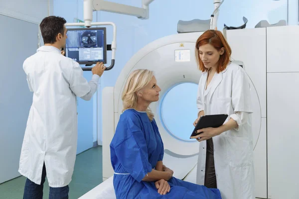 Radiologic technician and Patient being scanned and diagnosed on ...