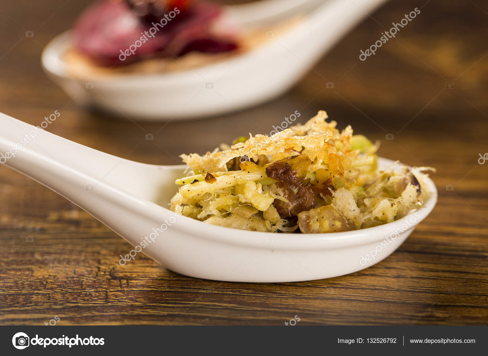 Shredded cod with scrambled eggs, banana puree and crispy potato in a ...