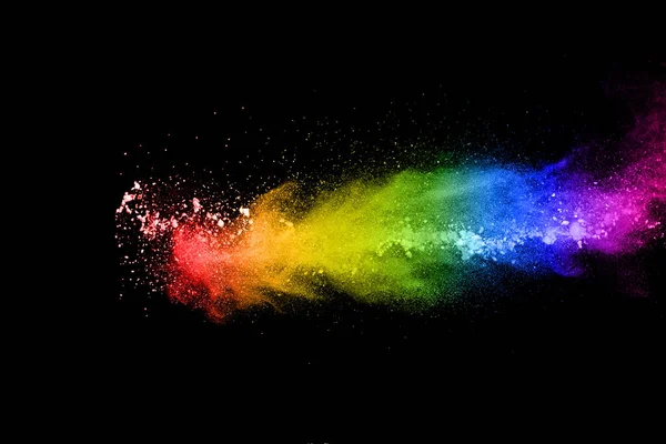 Multi colored dust splash on black background.Painted Holi.Colorful ...