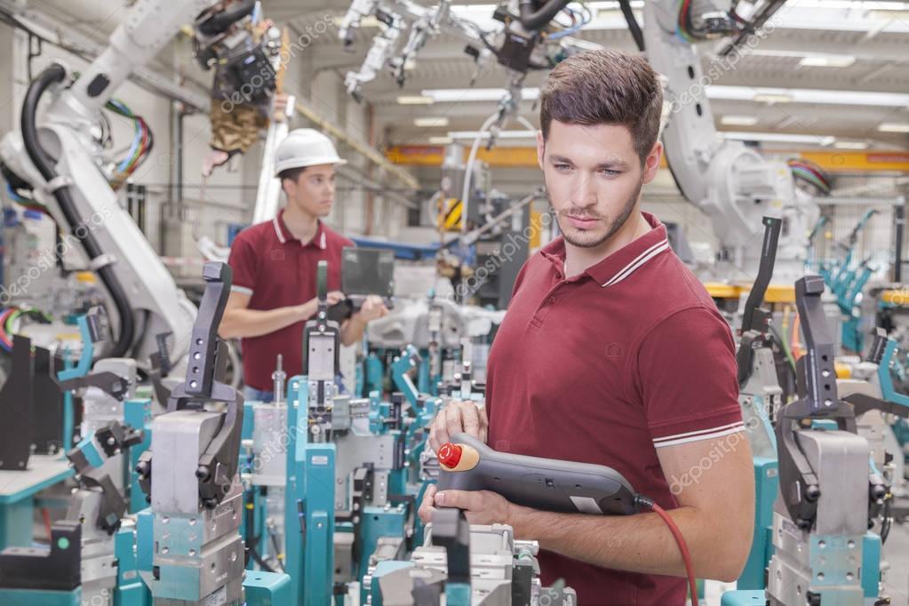 Development engineers at the robot commissioning — Stock Photo ...