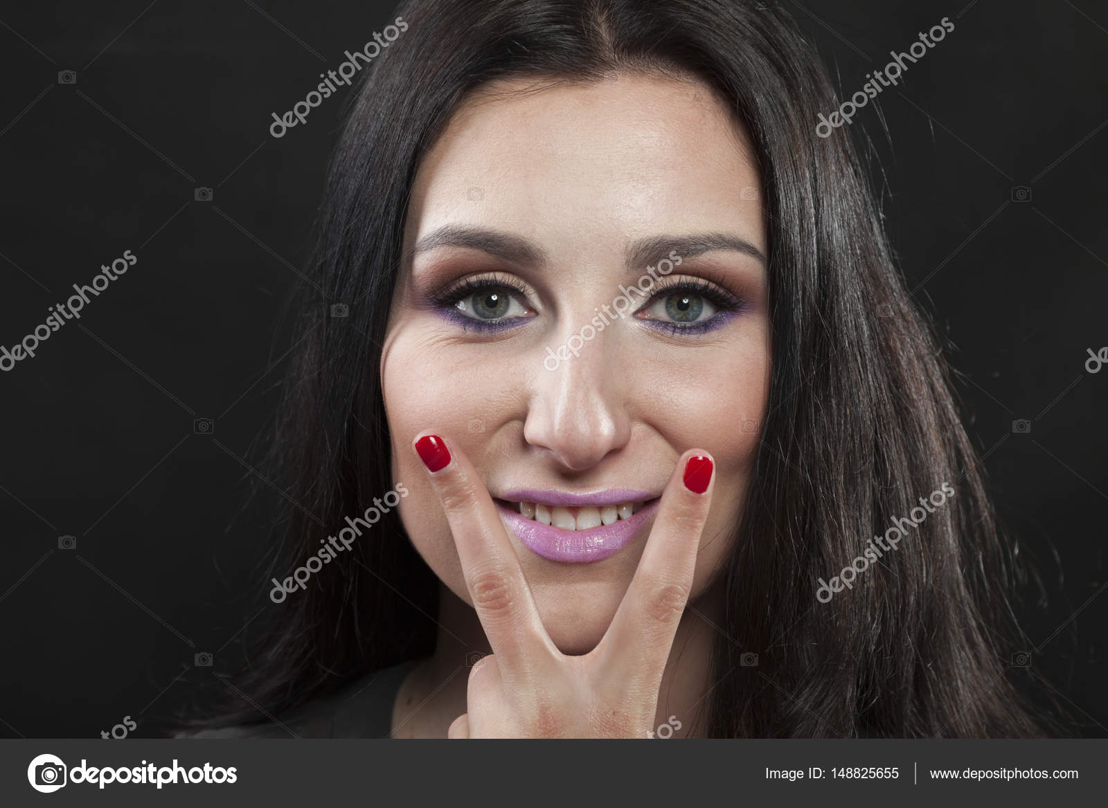 Woman makes V sign Stock Photo by ©vizualni 148825655