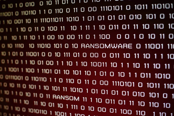 Digital economy. Coin stack with digital lock and hack ransom text in computer monitor screen in ...