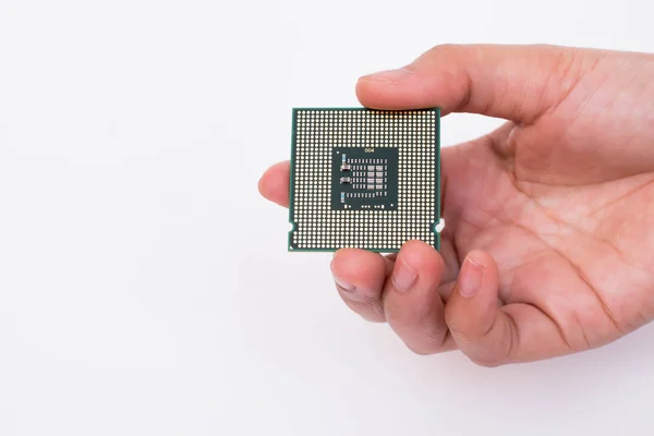 Man hand holding CPU Central processing unit gray background Stock ...