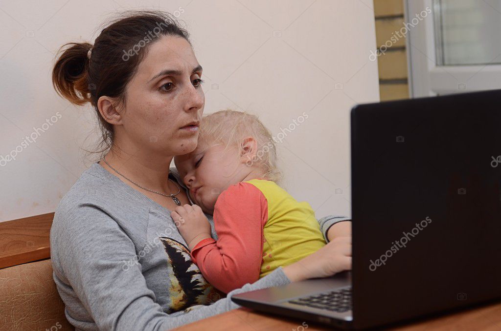 Mother working by the computer Stock Photo by ©shapovaLOVEa 125921908