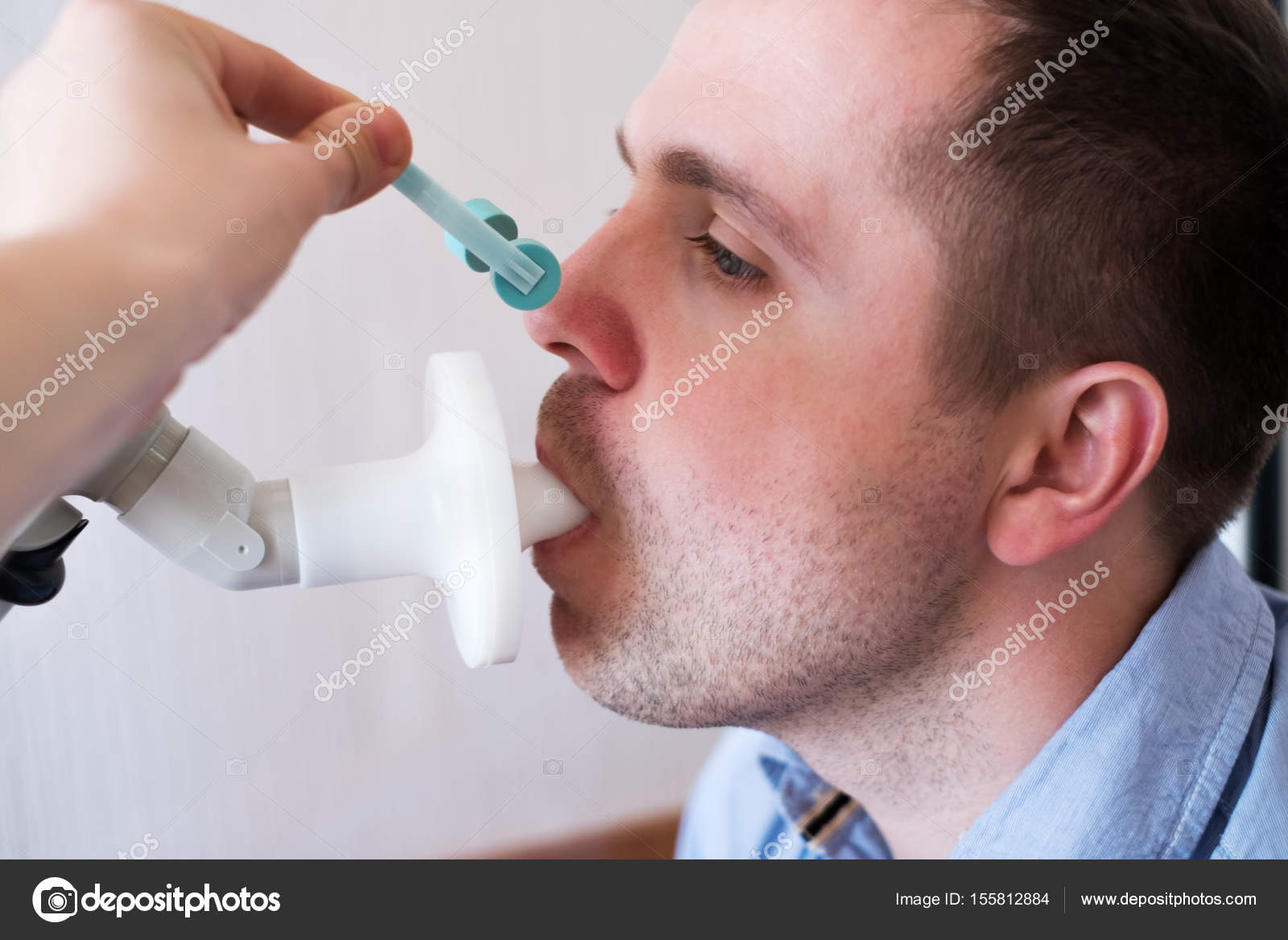 Young man testing breathing function by spirometry. — Stock Photo ...