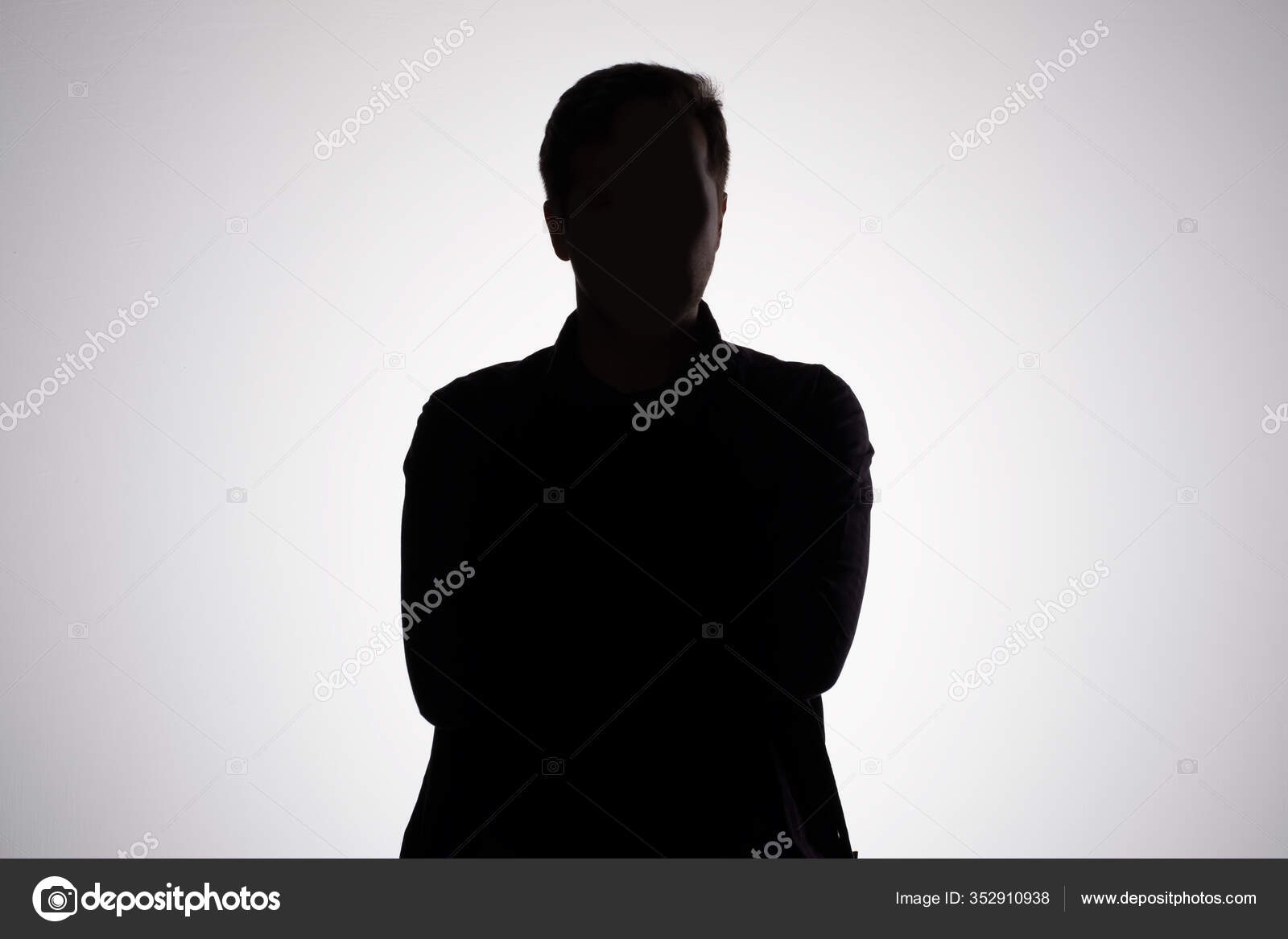 Man silhouette on gray studio wall. Studio shot — Stock Photo ...
