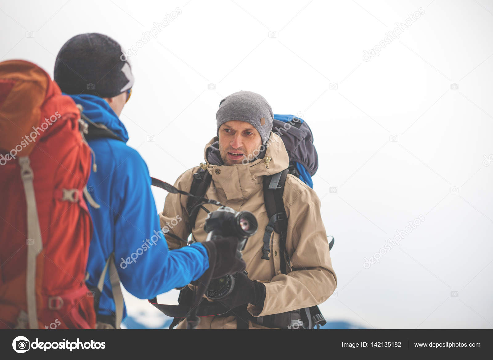 Two photographers talking while working. Stock Photo by ©zhukovvvlad ...