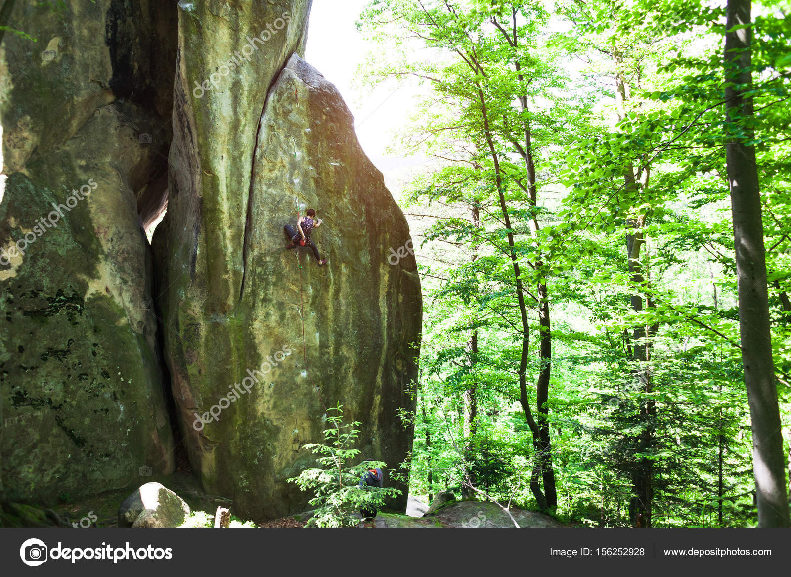 Girl is climbing the rock. Stock Photo by ©zhukovvvlad 156252928