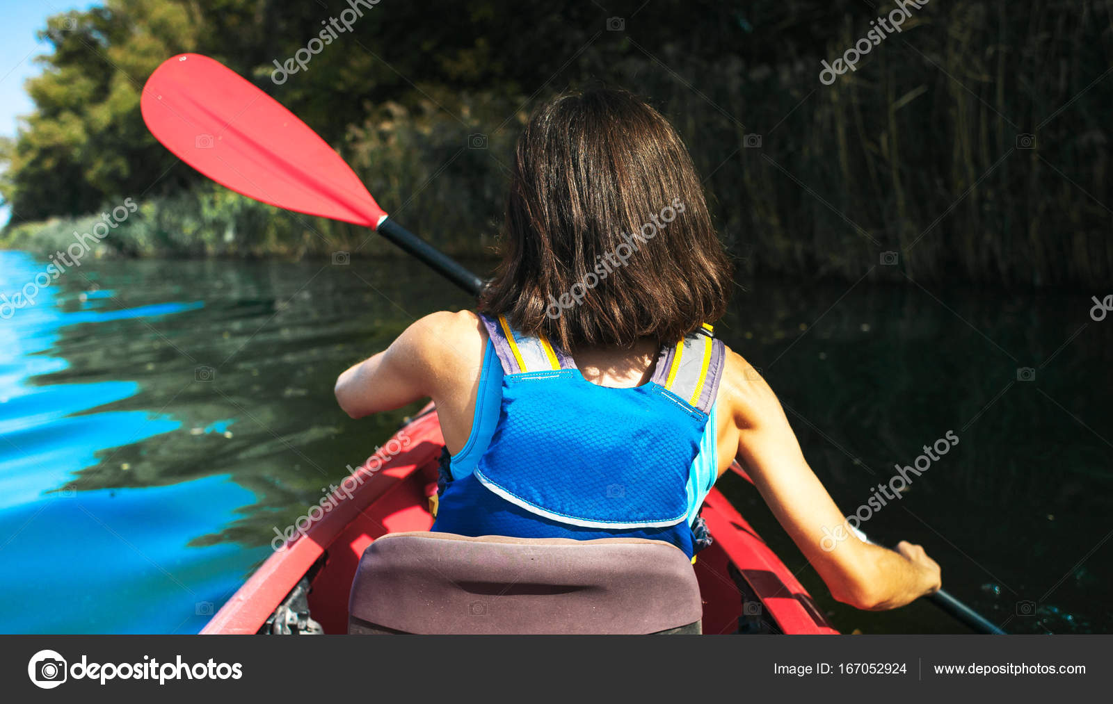 Girl in a kayak Stock Photo by ©zhukovvvlad 167052924