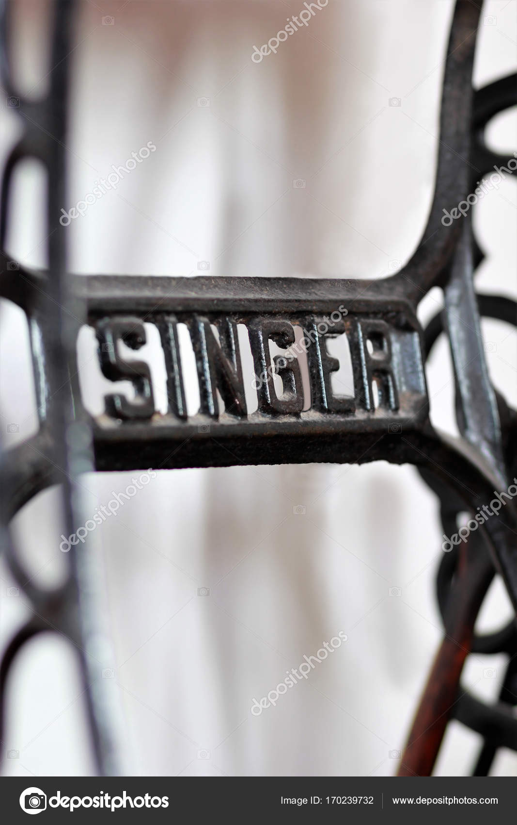 Close up of a metal Singer logo on an old american vintage manual ...