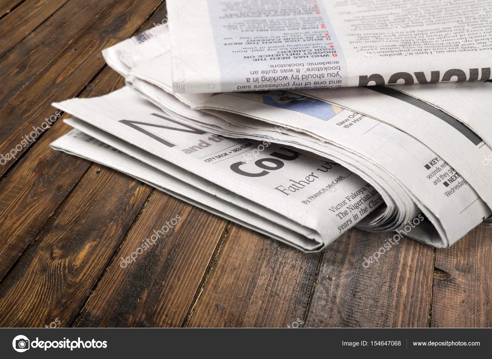 Stack Of Newspapers On Table