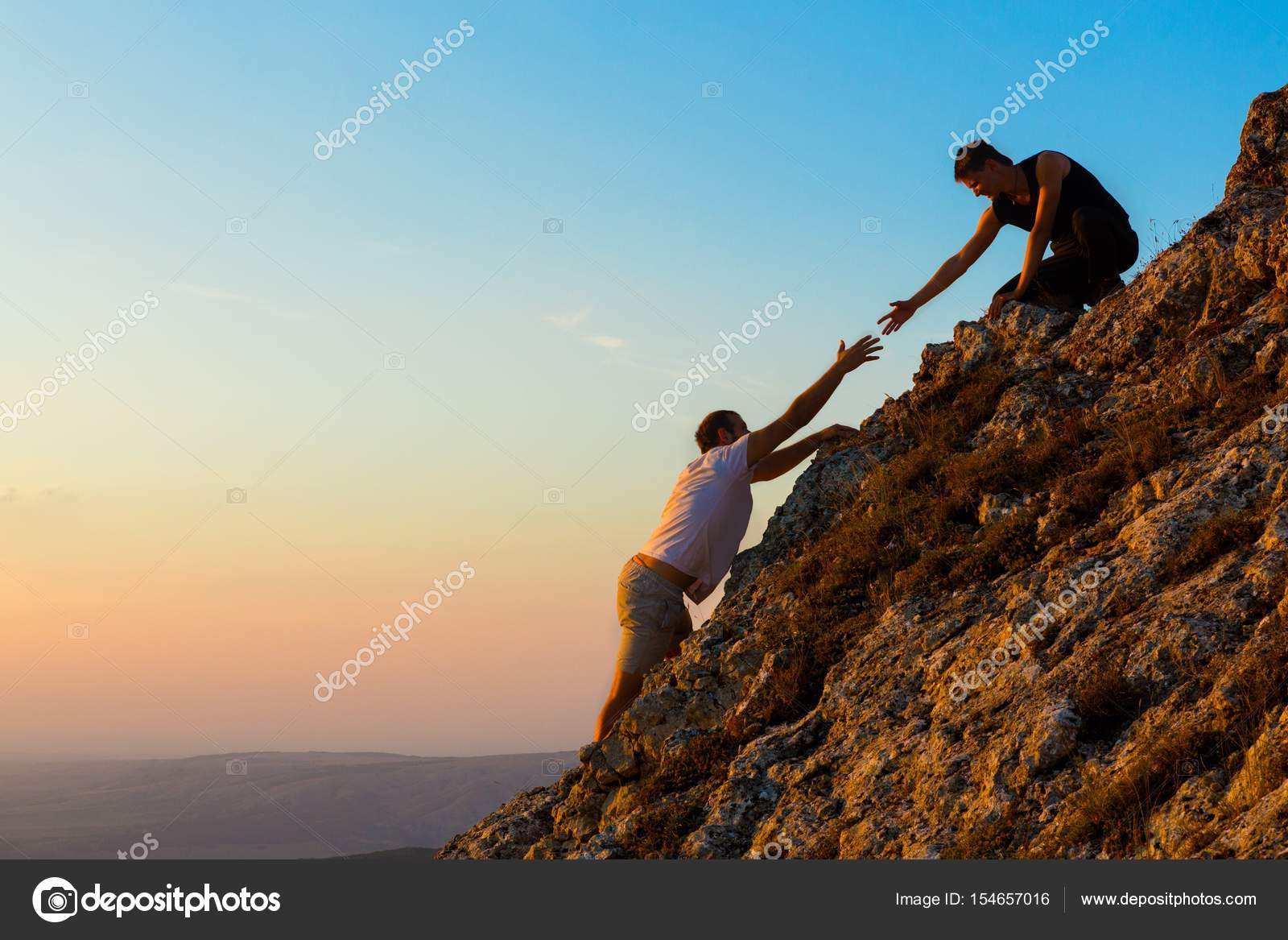 Men climbing on mountain Stock Photo by ©billiondigital 154657016