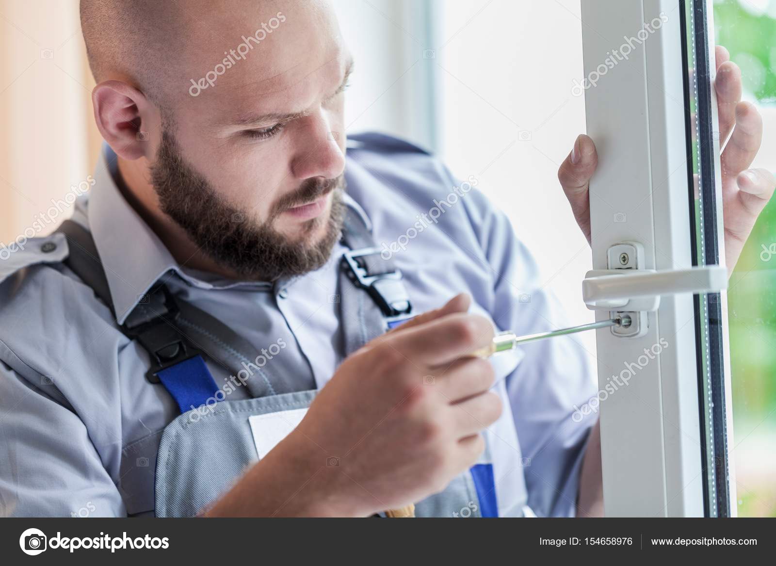 Repairman fixing window frame Stock Photo by ©billiondigital 154658976