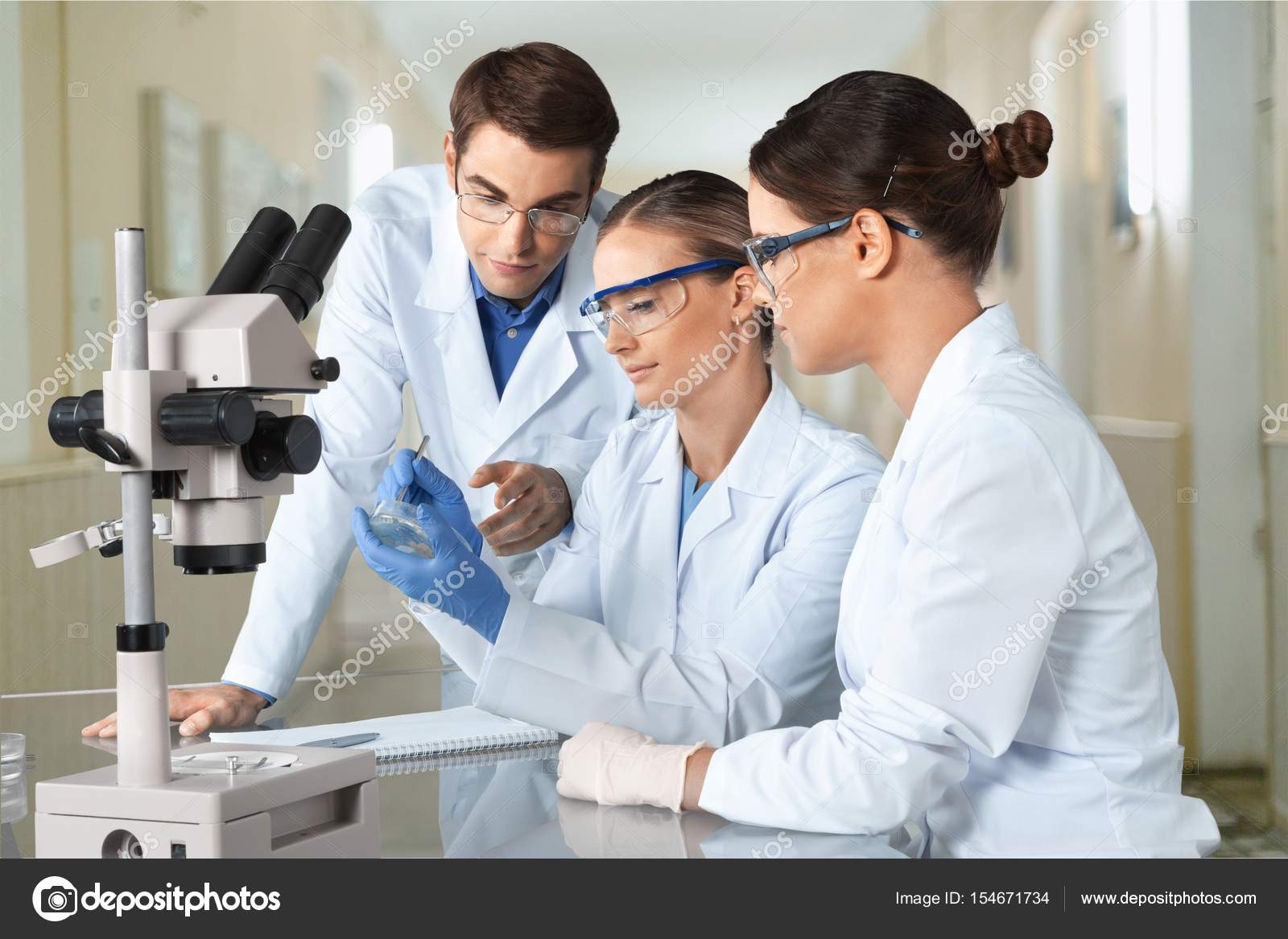 Scientists Working with Microscope — Stock Photo © billiondigital ...