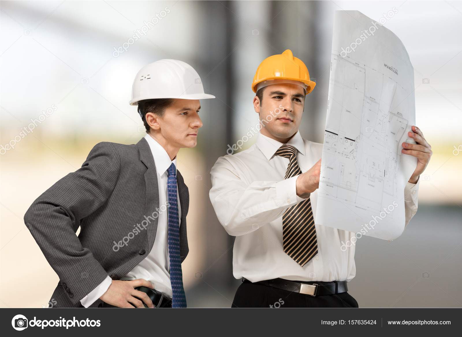 Architects discussing project Stock Photo by ©billiondigital 157635424
