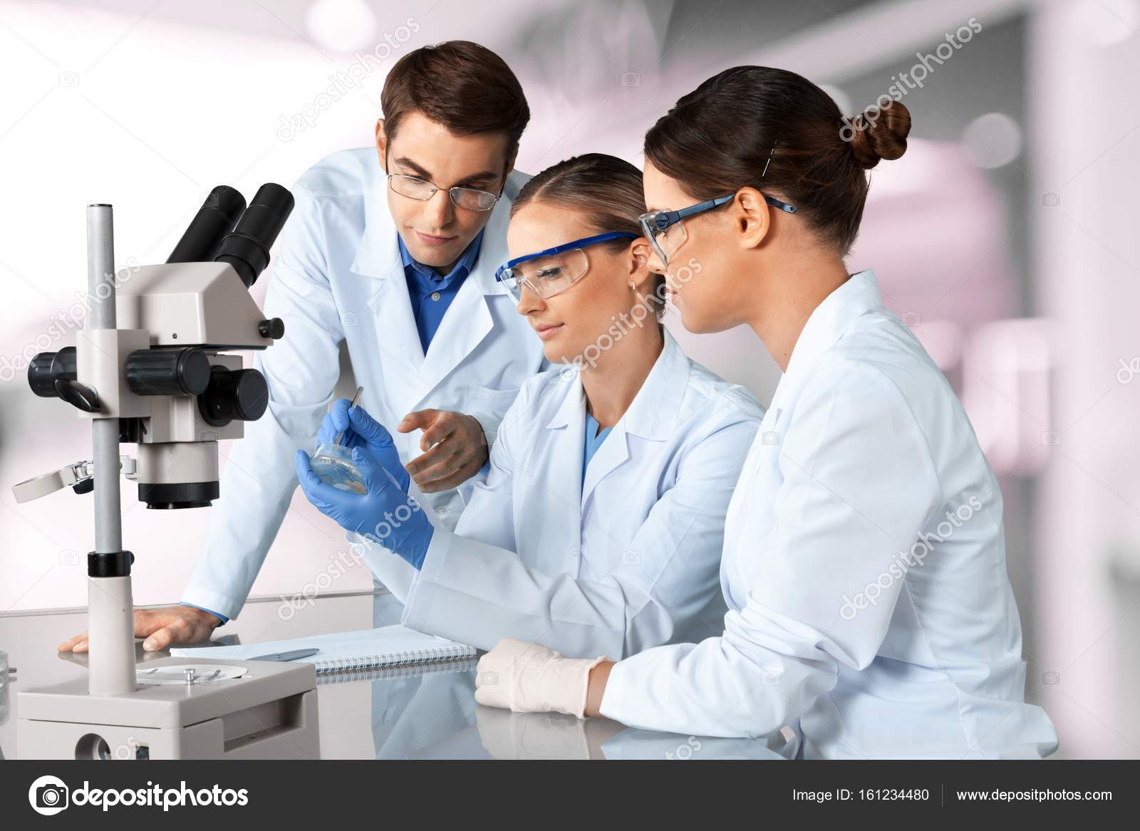 Scientists Working with Microscope — Stock Photo © billiondigital ... Scientists Working with Microscope — Stock Photo © billiondigital ...