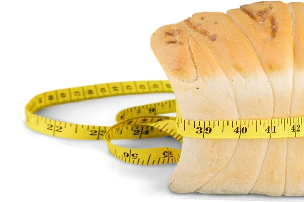Bread with measure tape indicating weight loss — Stock Photo © pogonici ...