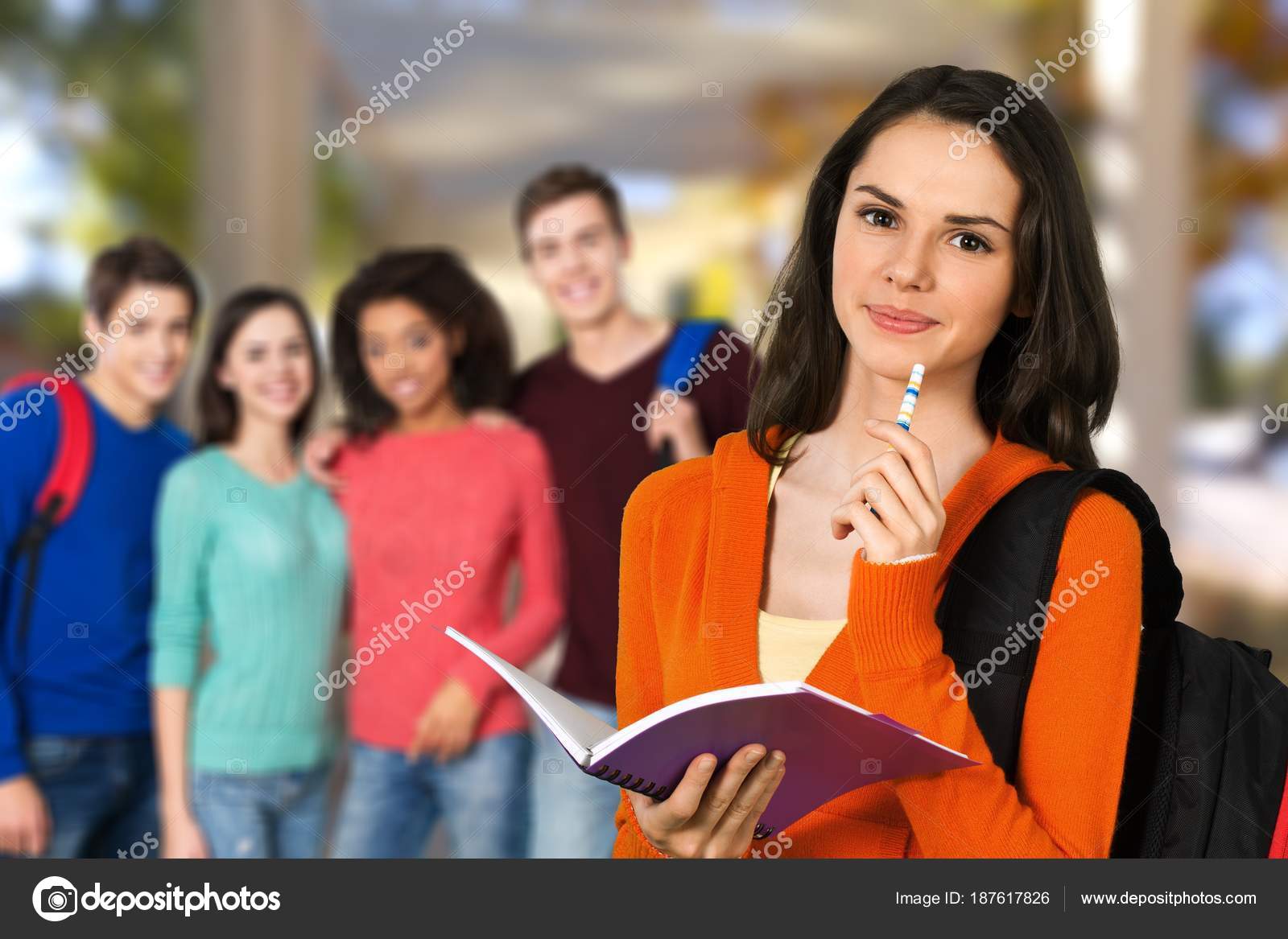 Young Female Student Holding Notebook — Stock Photo © billiondigital ...