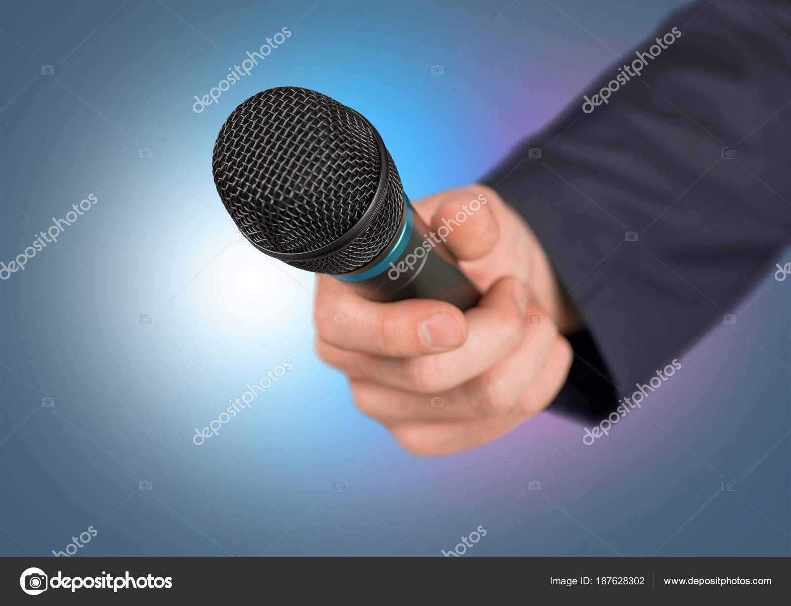 Hand holding microphone Stock Photo by ©billiondigital 187628302