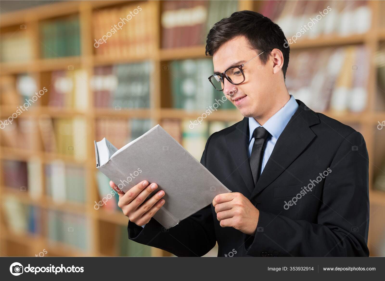Young Man Reading Book Library — Stock Photo © billiondigital #353932914