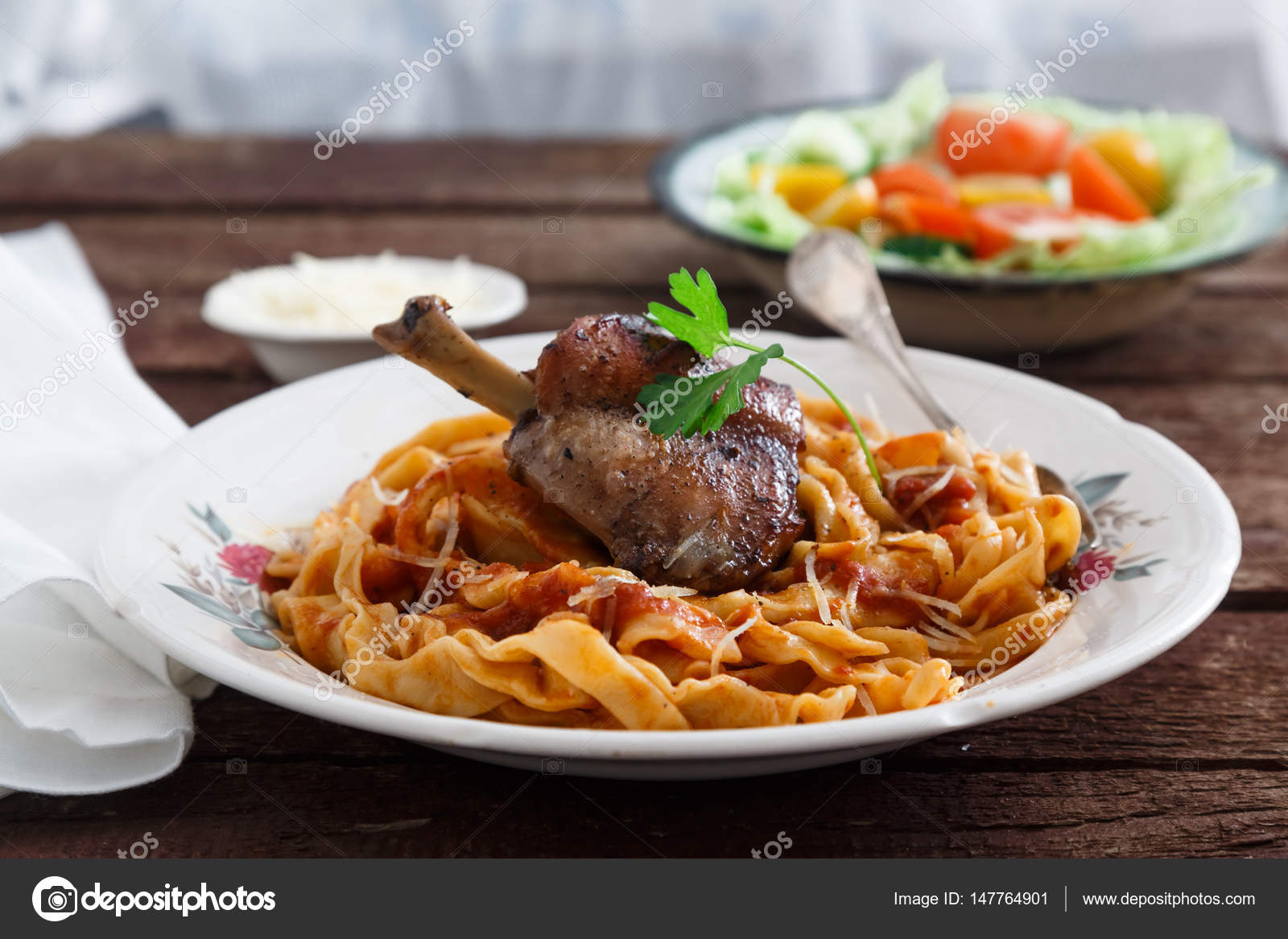 Braised Rabbit Leg in Tomato Sauce with Homemade pasta, dark rustic ...