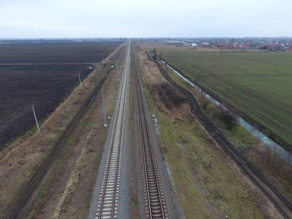 Plot railway. Top view on the rails. High-voltage power lines for ...