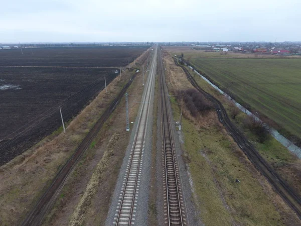 Plot railway. Top view on the rails. High-voltage power lines for ...