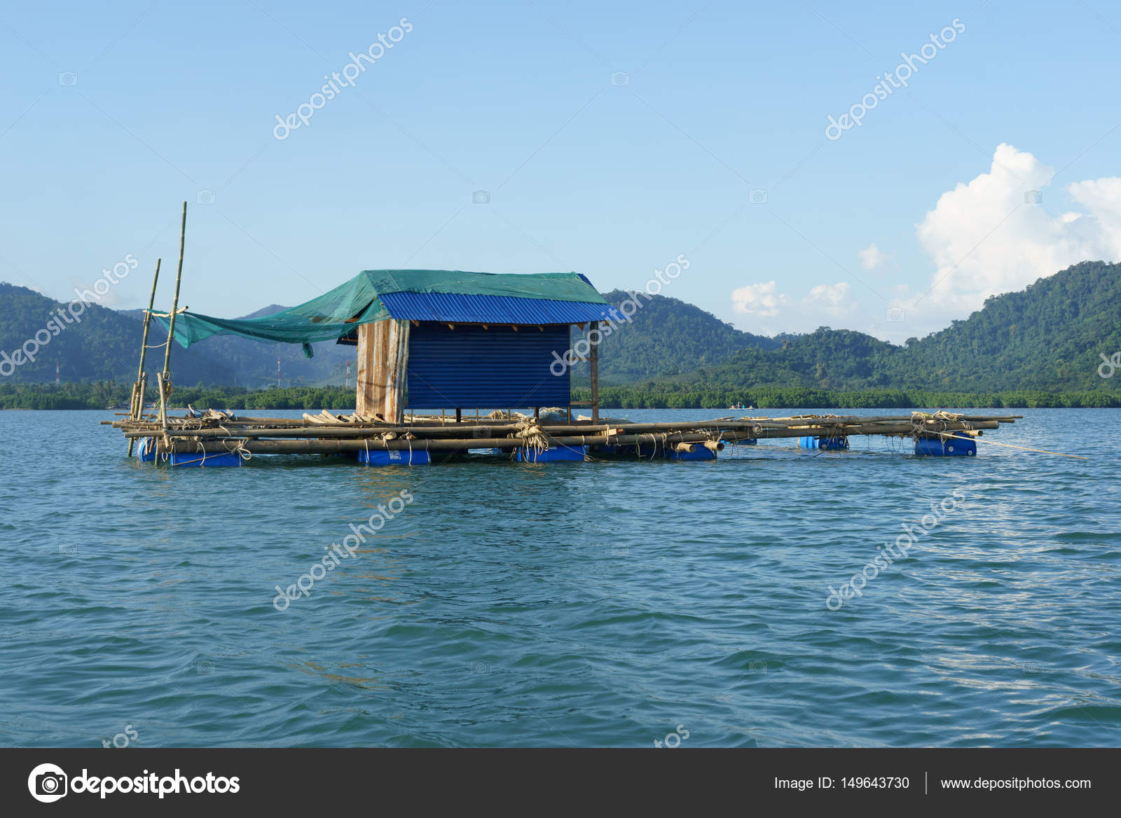 Bamboo raft floating on water with mountain background — Stock Photo ...