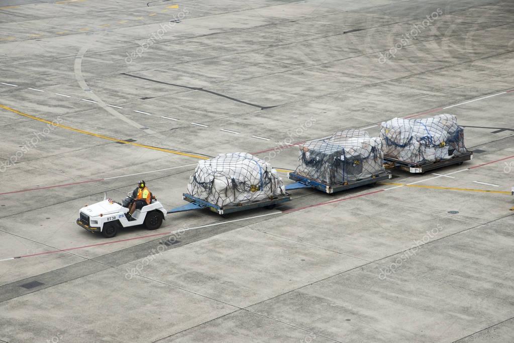 Baggage handling truck on an airport apron – Stock Editorial Photo ...