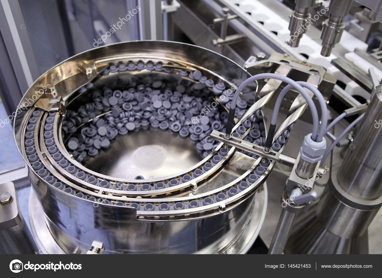 Sterile capsules for injection. Bottles on the bottling line of the ...