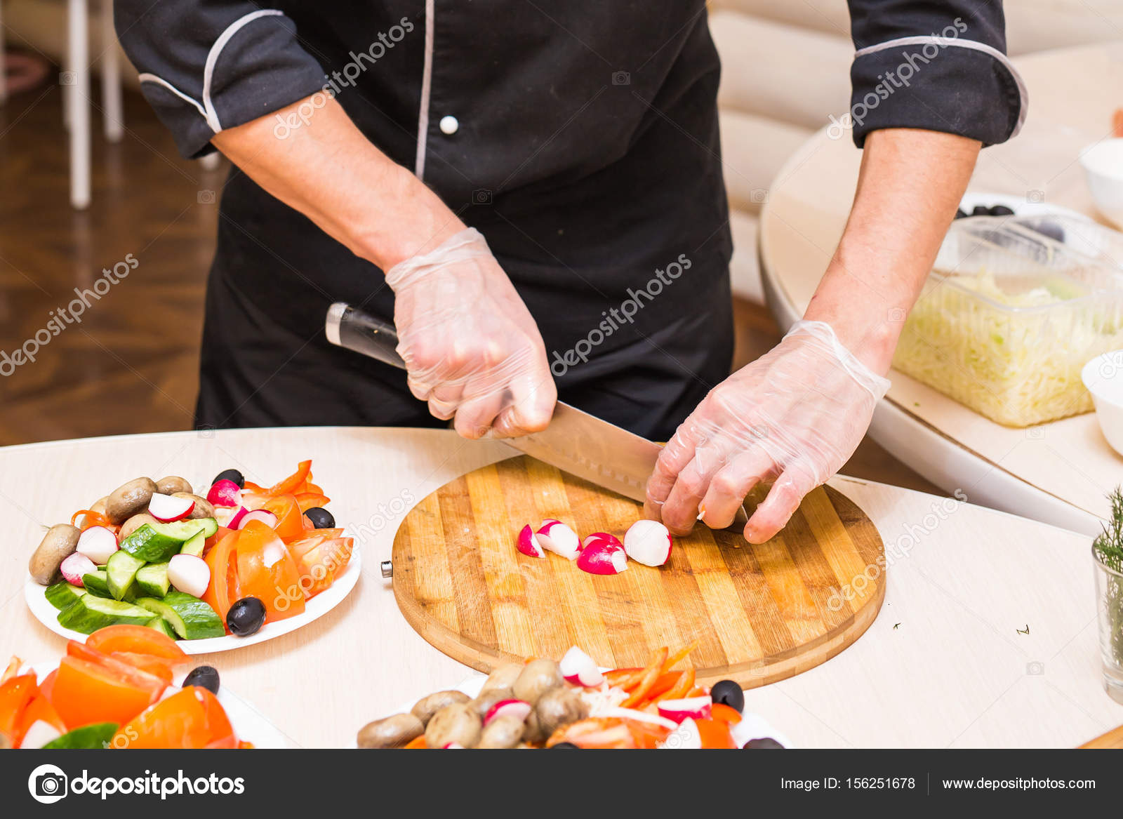 Close-up of chef cooking food kitchen restaurant cutting cook hands ...