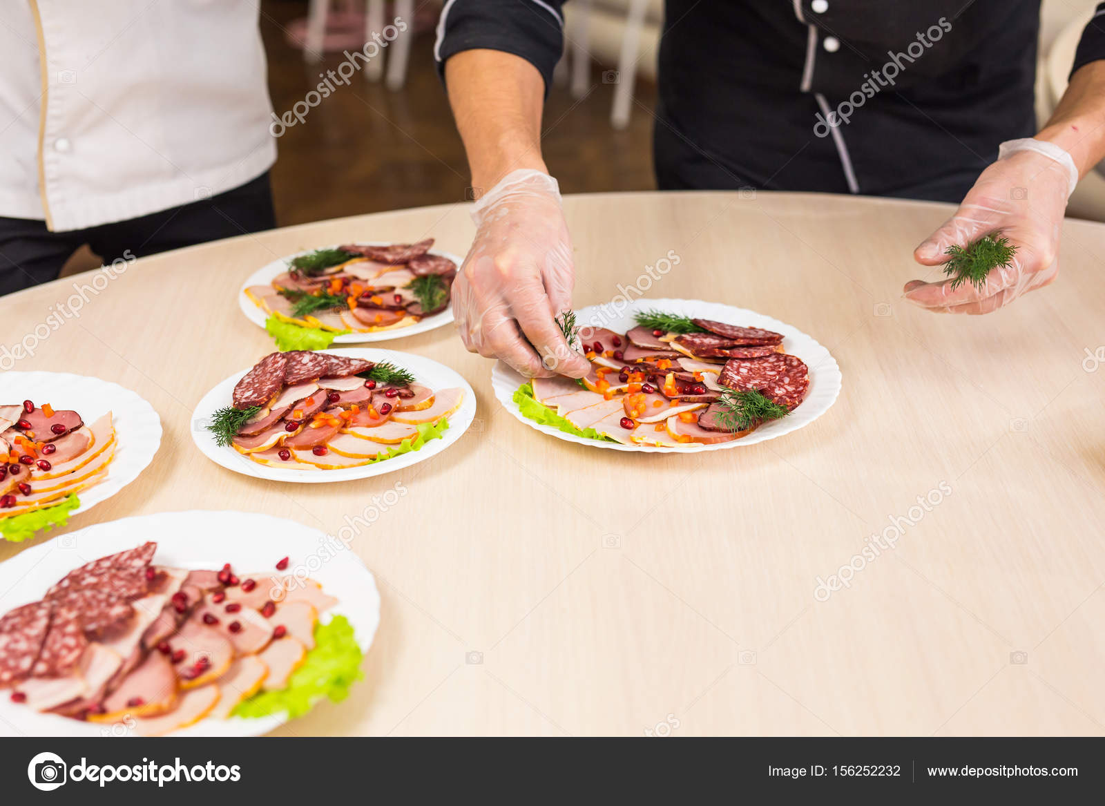 Close-up of chef cooking food kitchen restaurant cutting cook hands ...